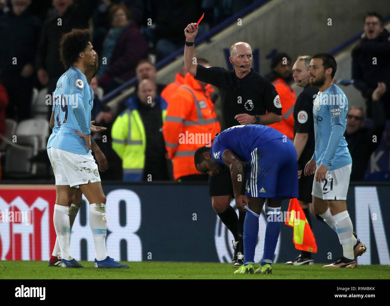 Manchester City's Fabian Delph (obscured) is sent off by referee Mike ...