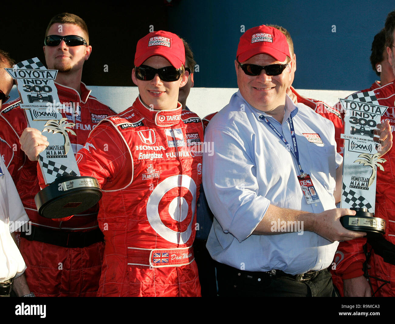 Dan Weldon (L) and tean owner Chip Gnassi celebrate winning the Toyota ...