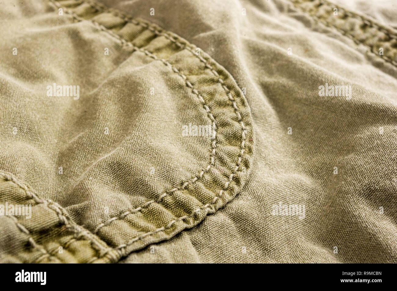 clothing items washed cotton fabric texture with seams, macro, close-up ...