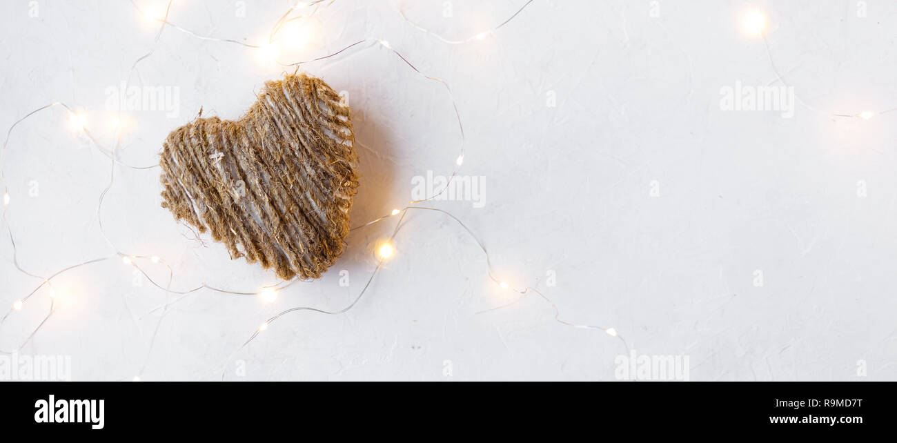 Decorative heart in rustic style lights on a white background Copy ...