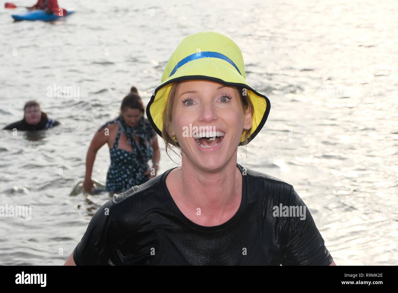 West Bay, Dorset, UK. 26th December 2018.Hundreds of swimmers, many in ...