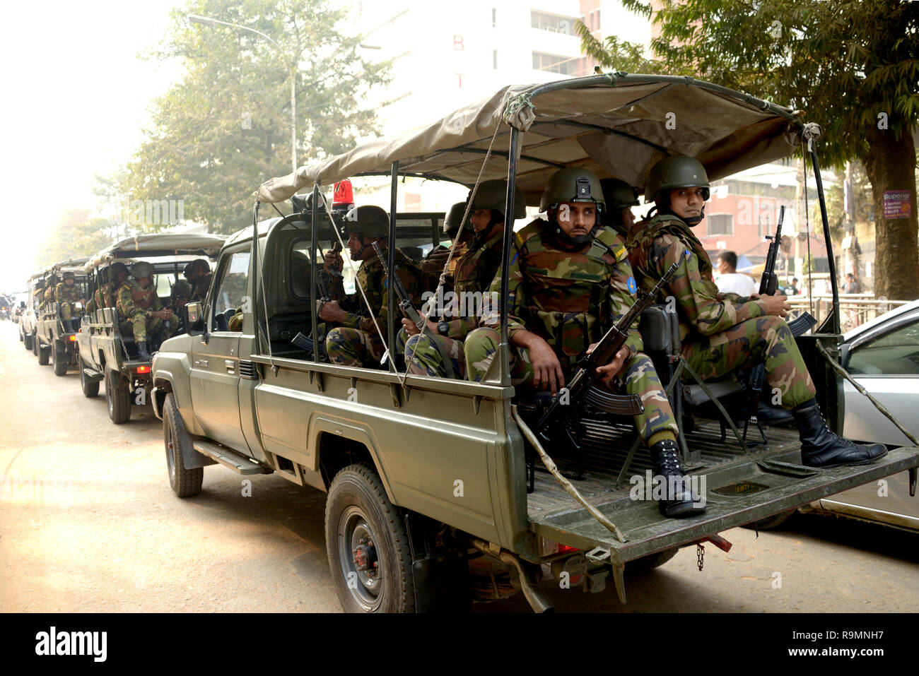 Dhaka, Bangladesh. 26th Dec, 2018. Vehicles with Army soldiers drive on ...