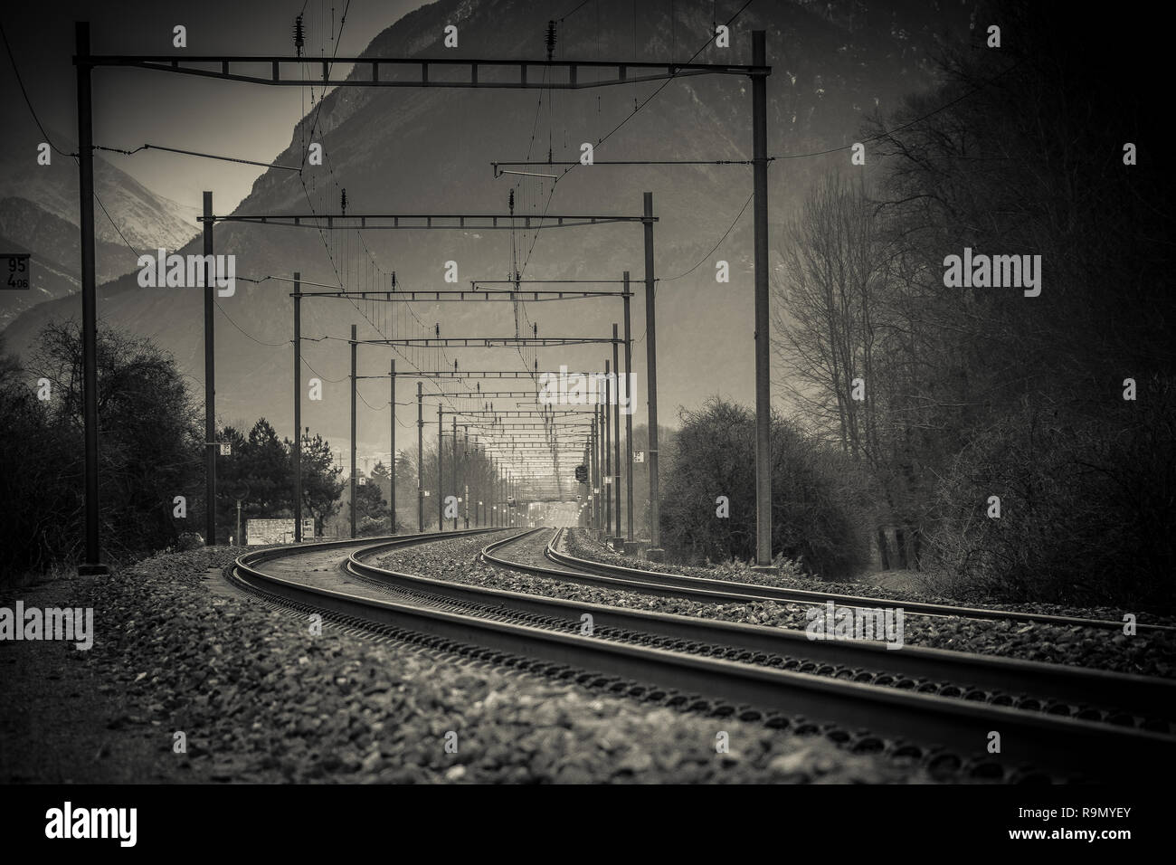 Dark rail train at morning Stock Photo - Alamy