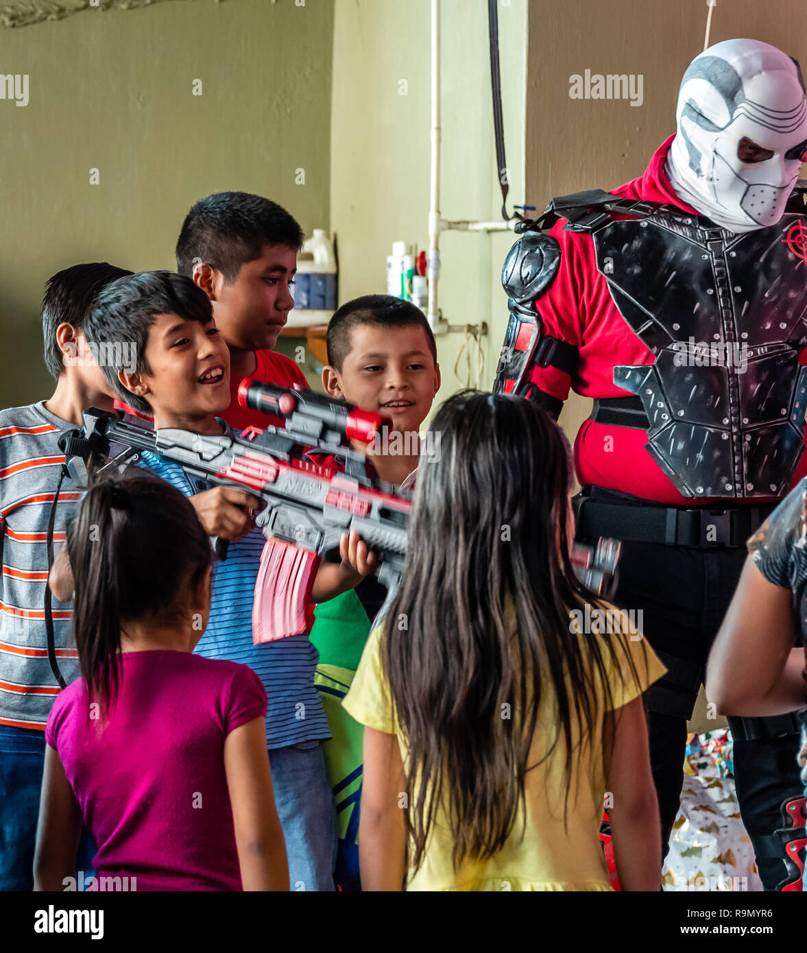 Guatemalan children with super hero in Guatemala Stock Photo - Alamy