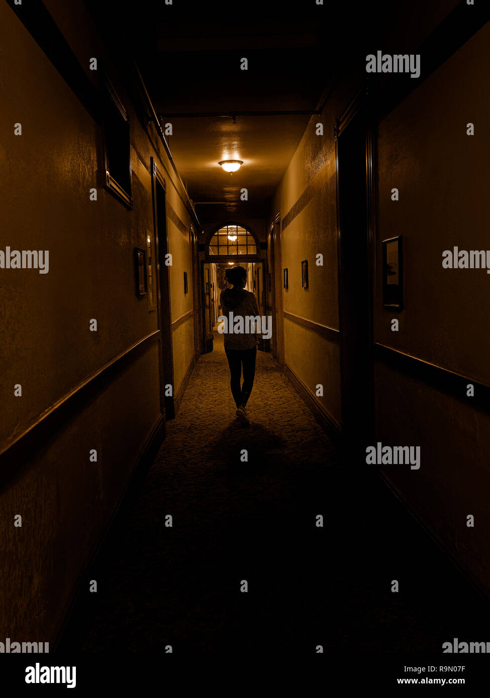Spooky girl in hallway hi-res stock photography and images - Alamy