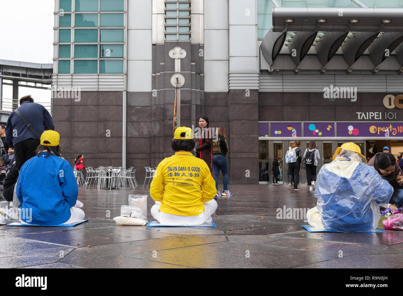 Falun Gong followers meditate outside Taipei 101 in Taipei, Taiwan, on ...
