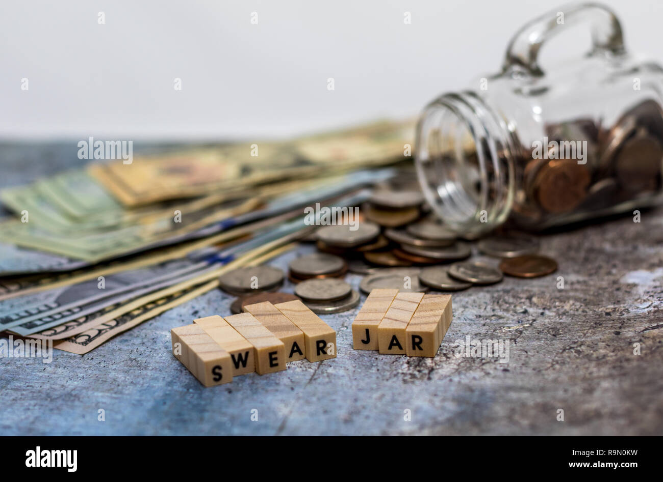 Swear Jar challenge concept with glass jar filled with coins, New Year ...