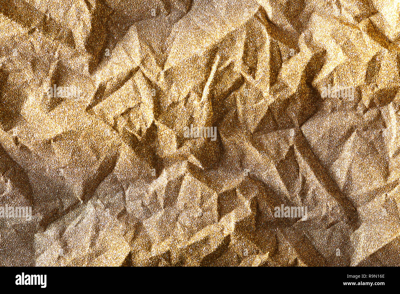 Gold glitter shiny crumpled wrapping paper background Stock Photo - Alamy