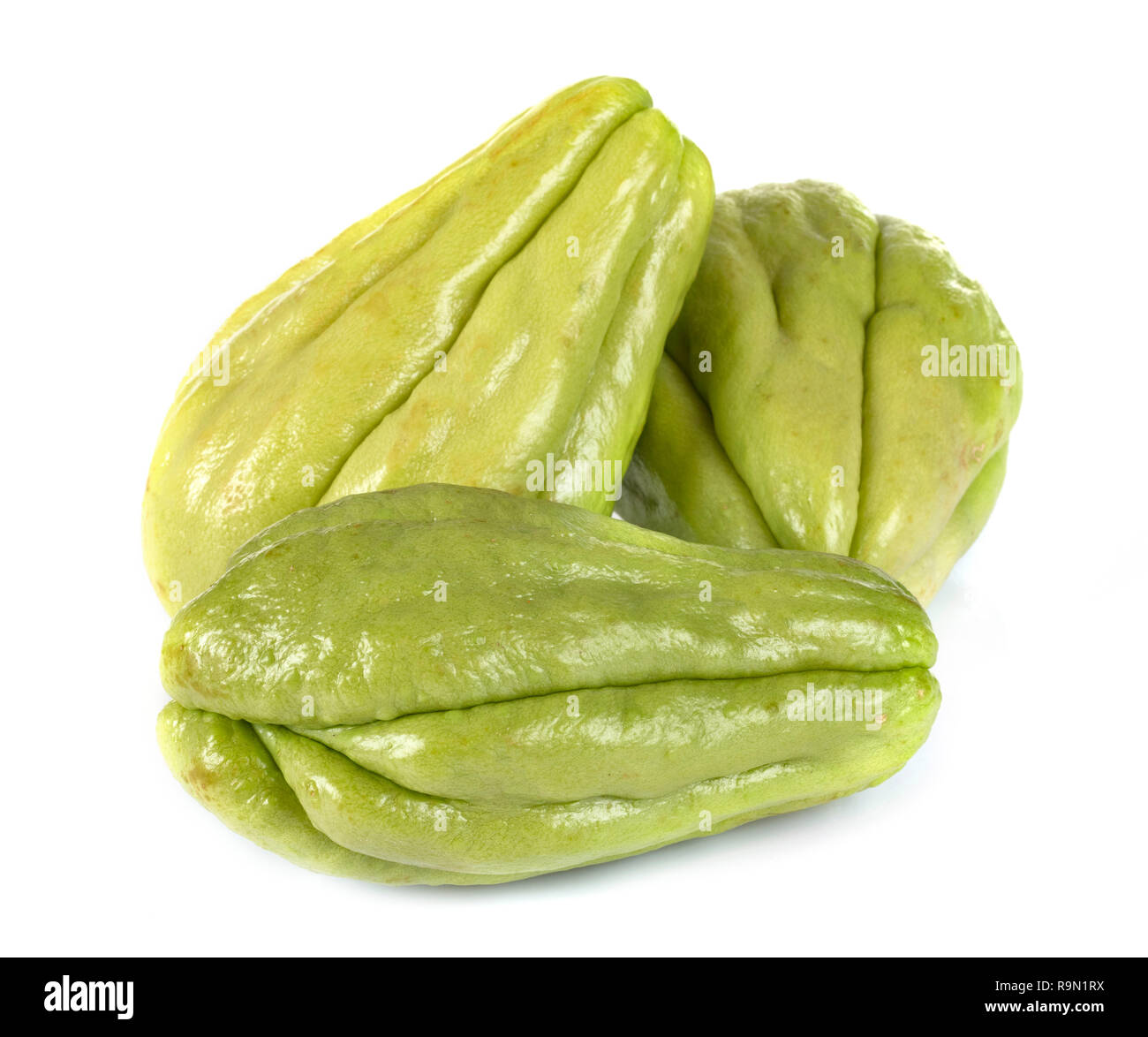 mirliton squash in front of white background Stock Photo - Alamy