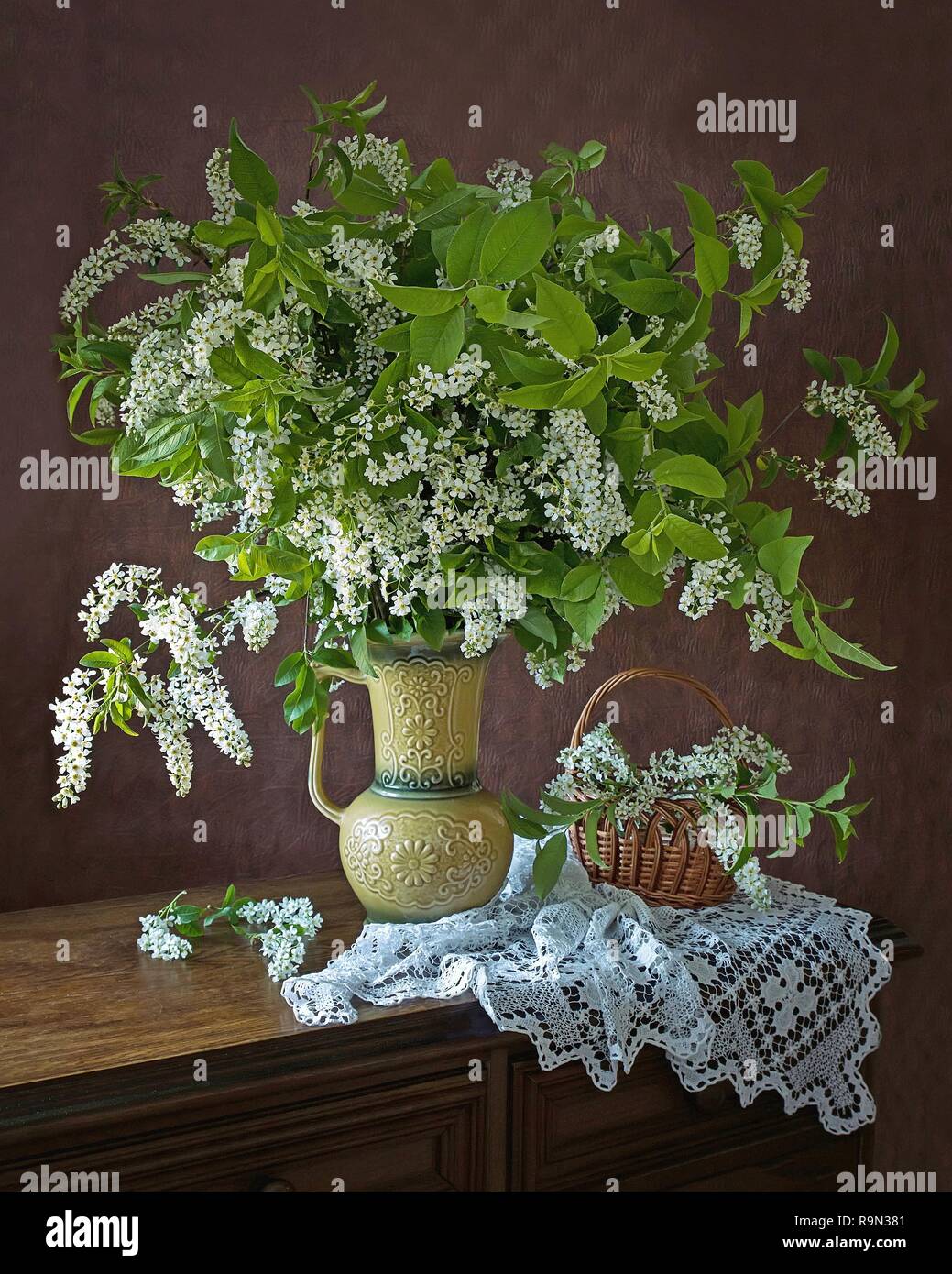 Still life with bouquet of wild cherry branches Stock Photo - Alamy