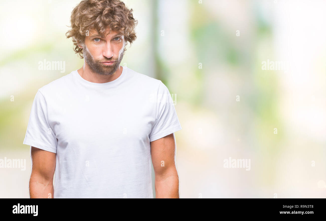 Handsome hispanic model man over isolated background depressed and ...