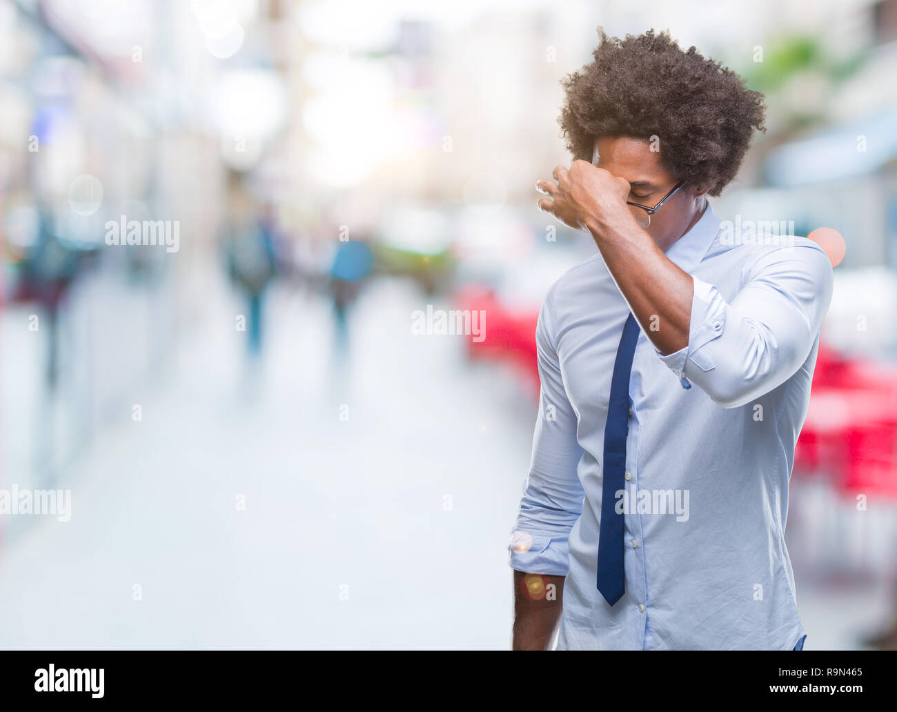 Afro american business man wearing glasses over isolated background ...