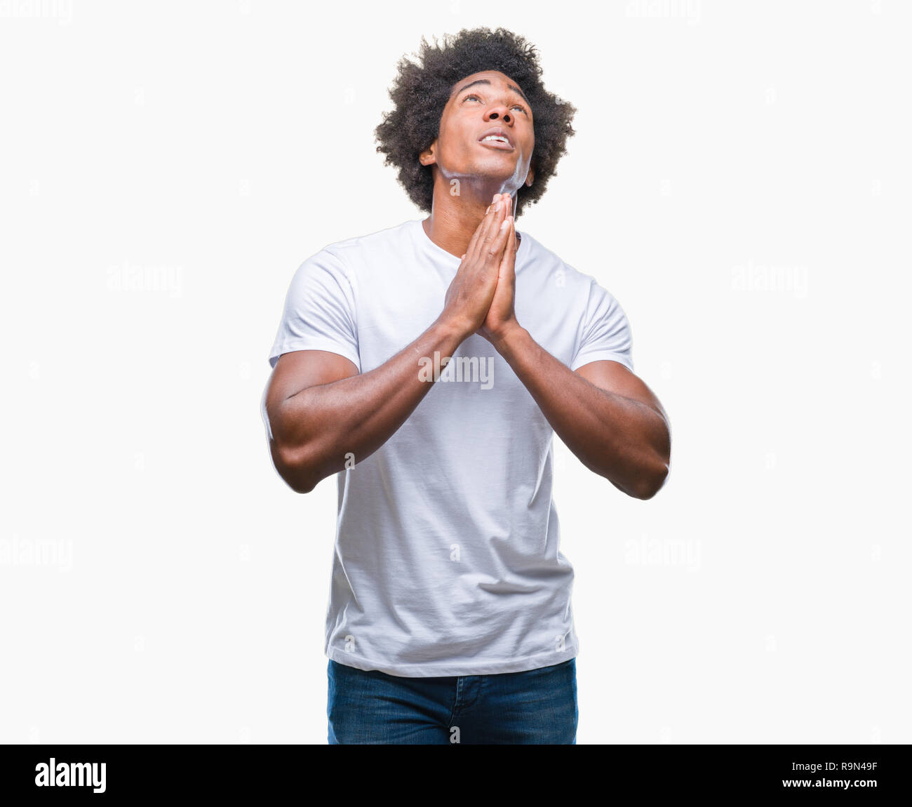 Afro american man over isolated background begging and praying with ...
