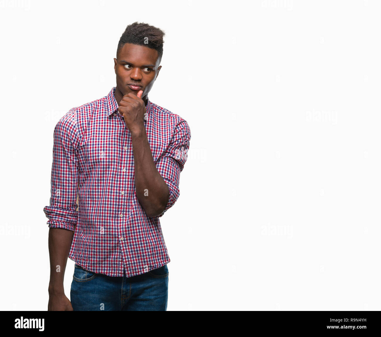 Young african american man over isolated background with hand on chin ...