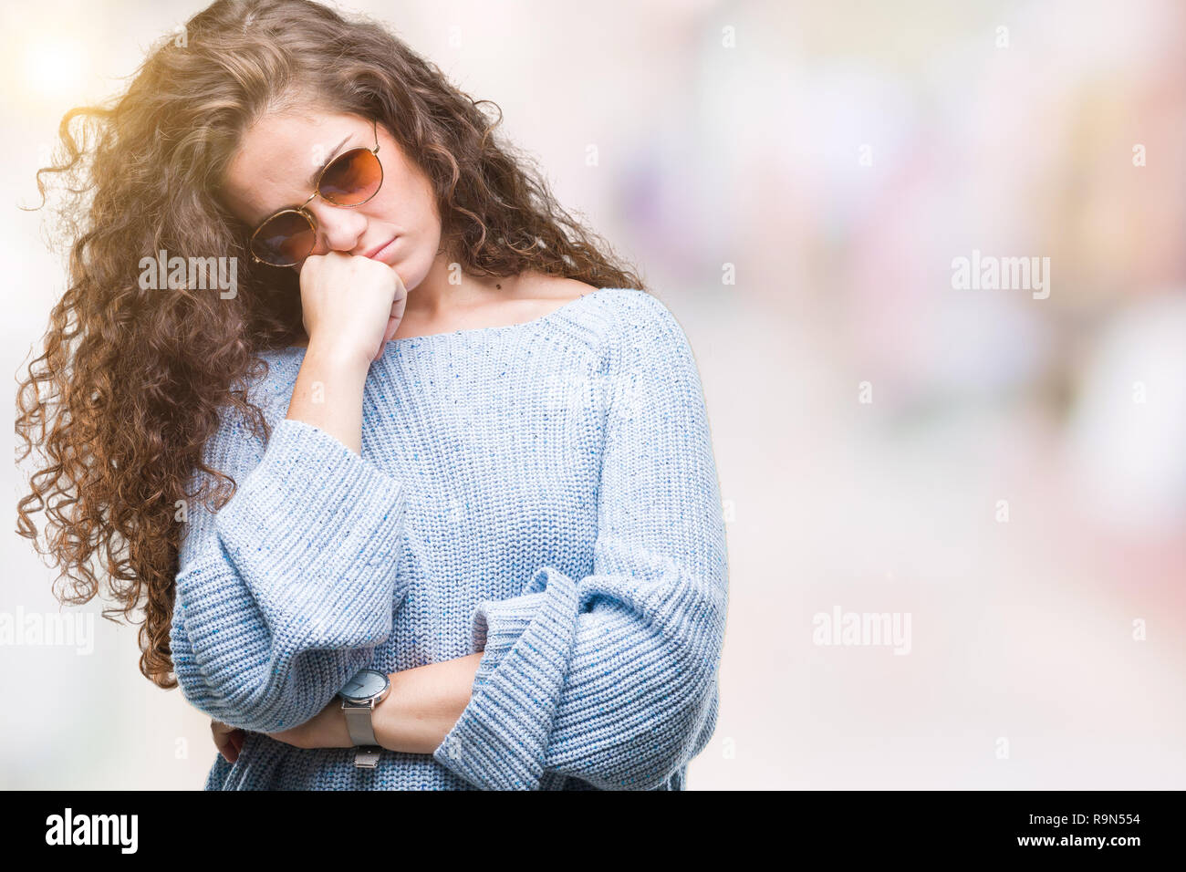 Beautiful brunette curly hair young girl wearing sunglasses over ...