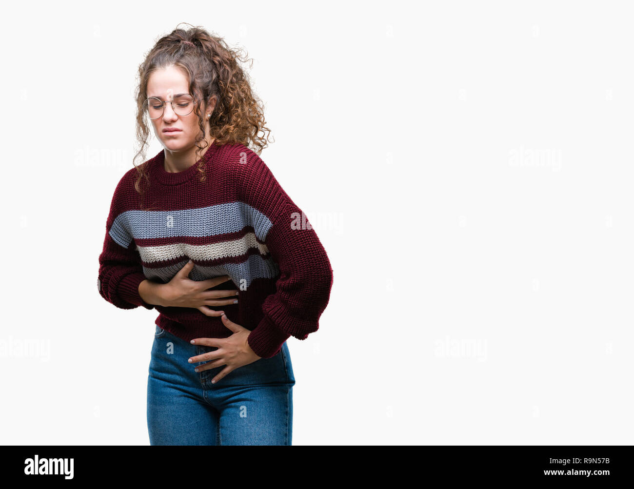Beautiful brunette curly hair young girl wearing glasses over isolated ...