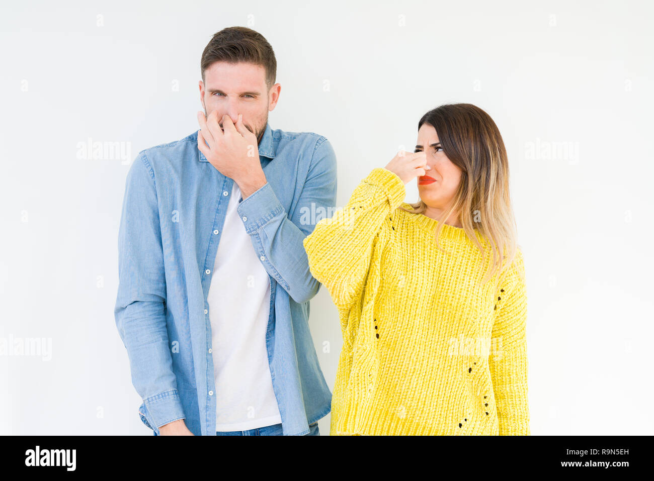 Woman holding nose smell man hi-res stock photography and images - Alamy