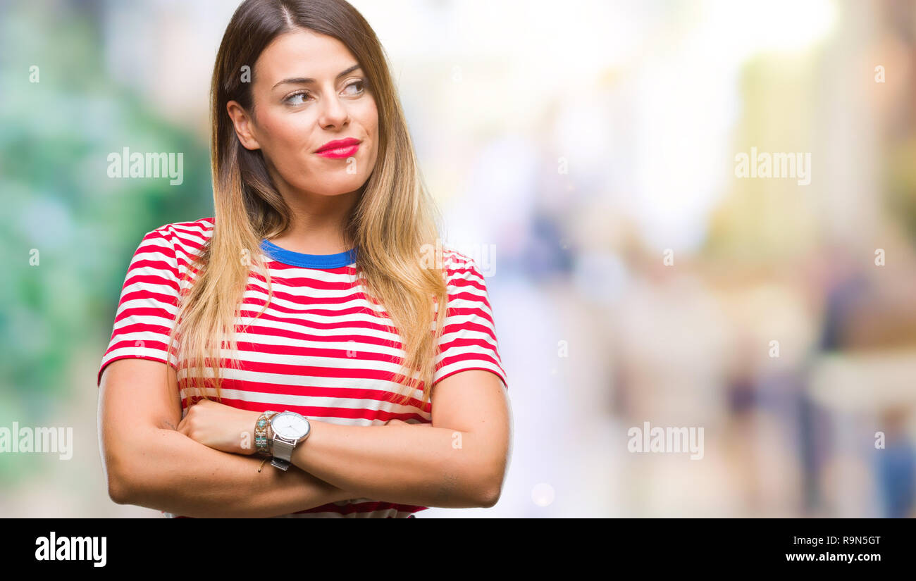 Young beautiful woman casual look over isolated background smiling ...
