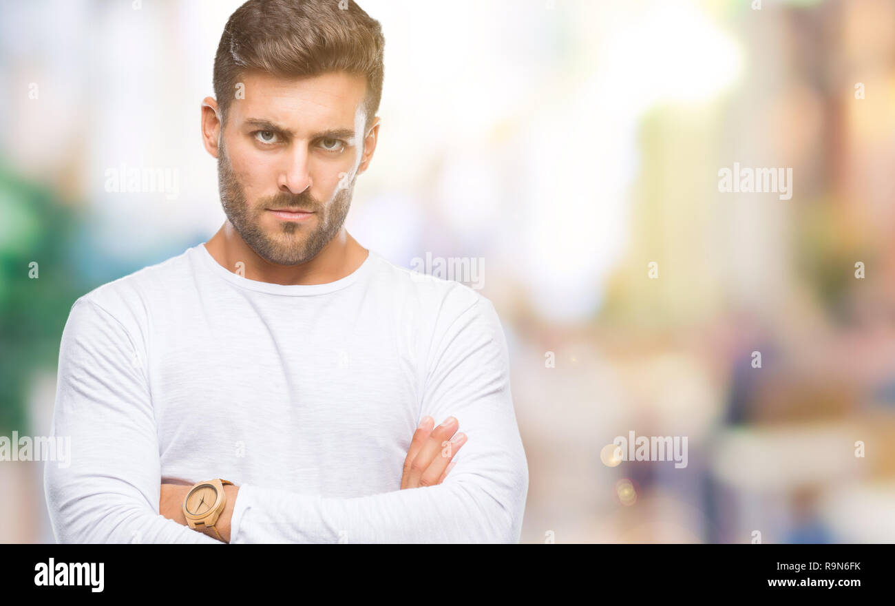 Young handsome man over isolated background skeptic and nervous ...