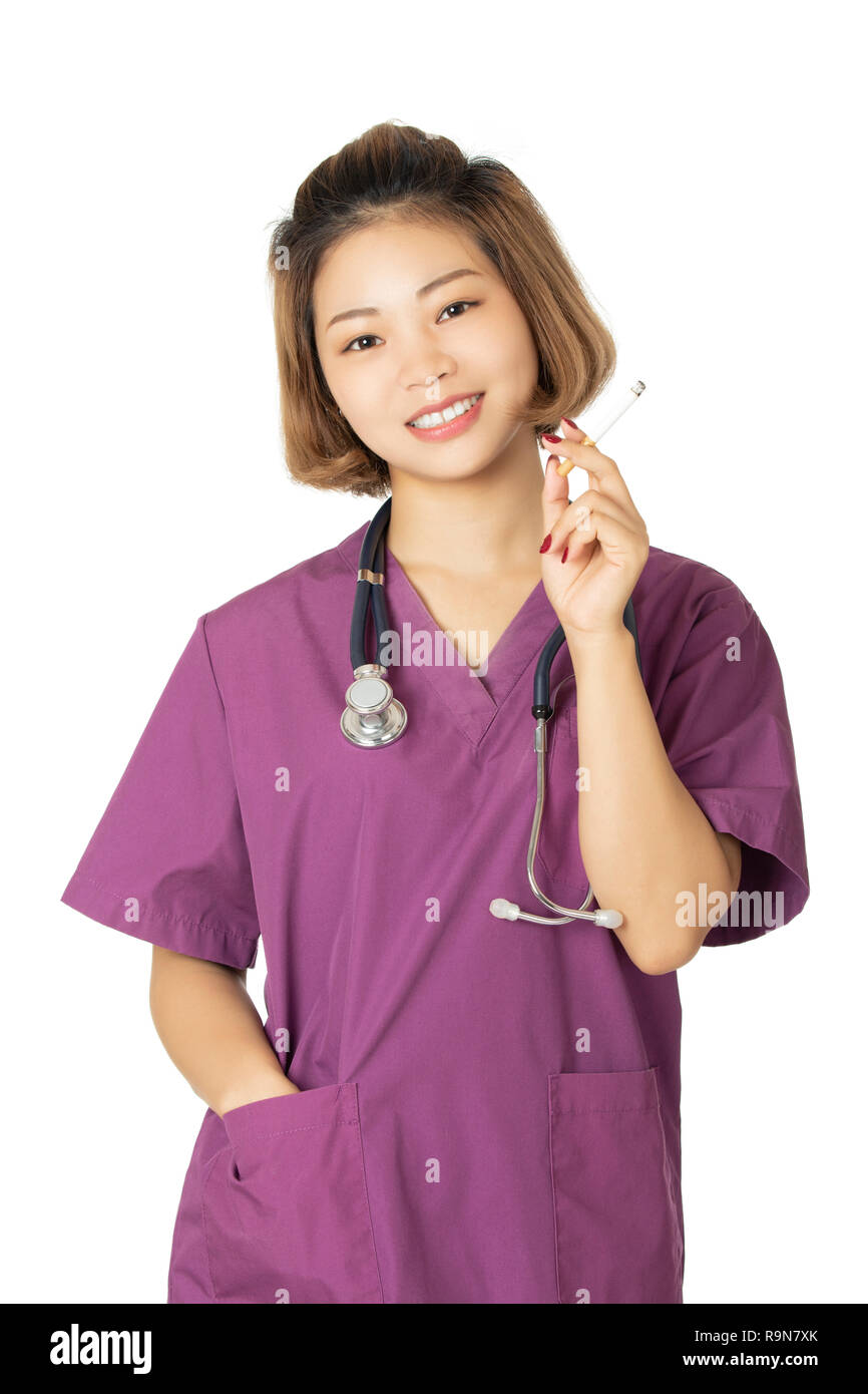 Beautiful Asian doctor or nurse smoking a cigarette isolated on a white ...