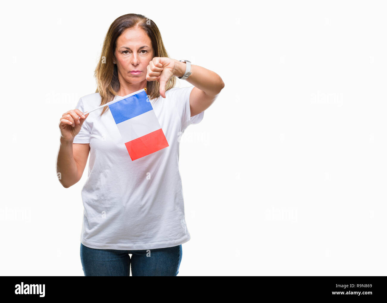 Middle age hispanic woman holding flag of France over isolated ...