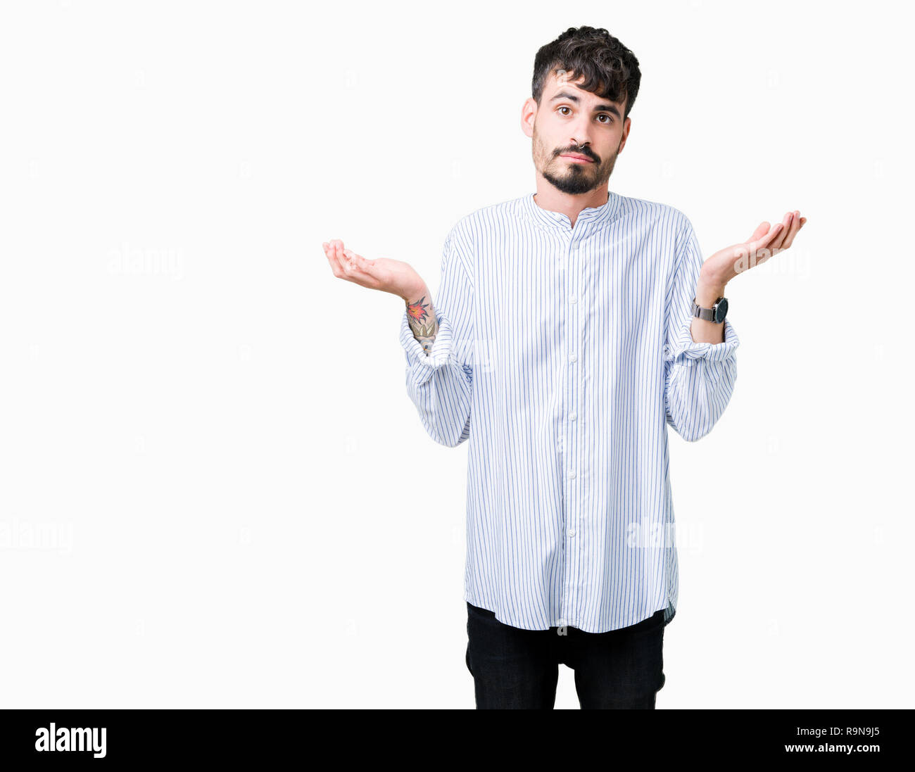 Young handsome business man over isolated background clueless and ...