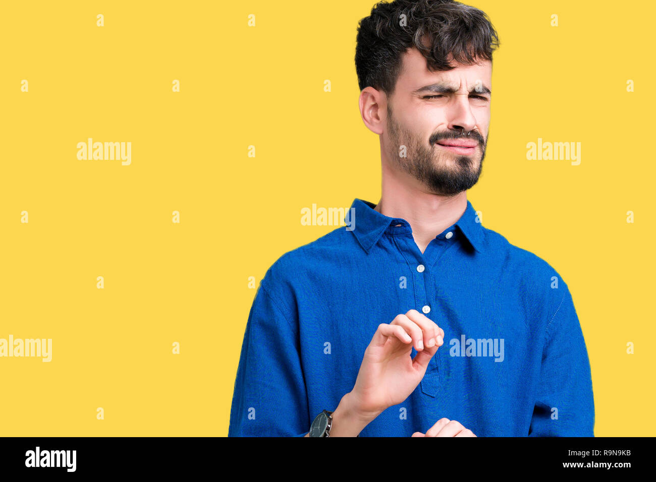 Young handsome man over isolated background disgusted expression ...