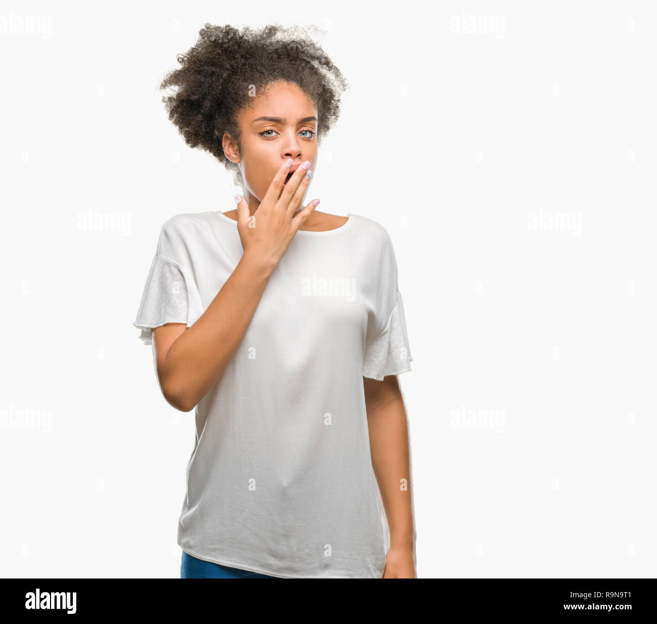 Young afro american woman over isolated background bored yawning tired ...