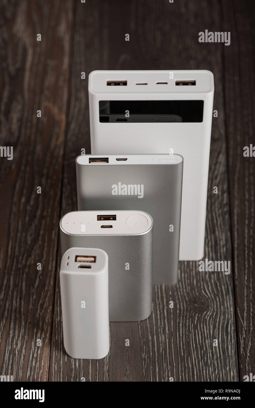Power banks on wooden table Stock Photo - Alamy