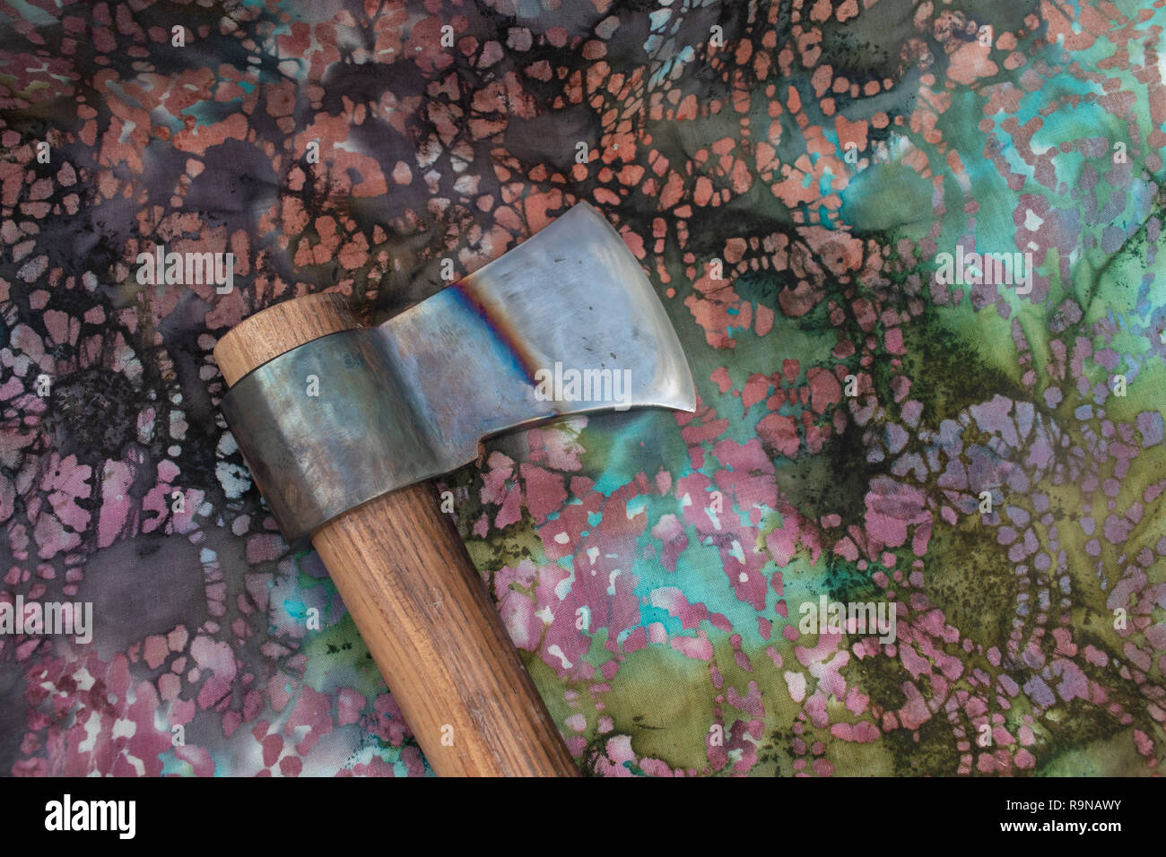 A streak of color on this hand forged tomahawk makes an interesting ...