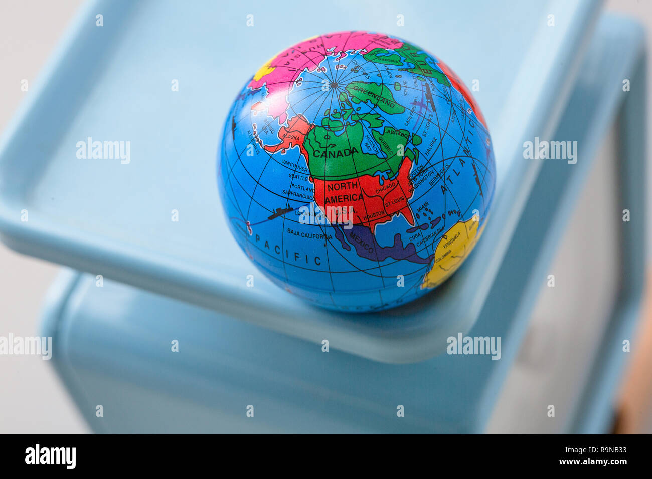 Scale and globe Stock Photo - Alamy