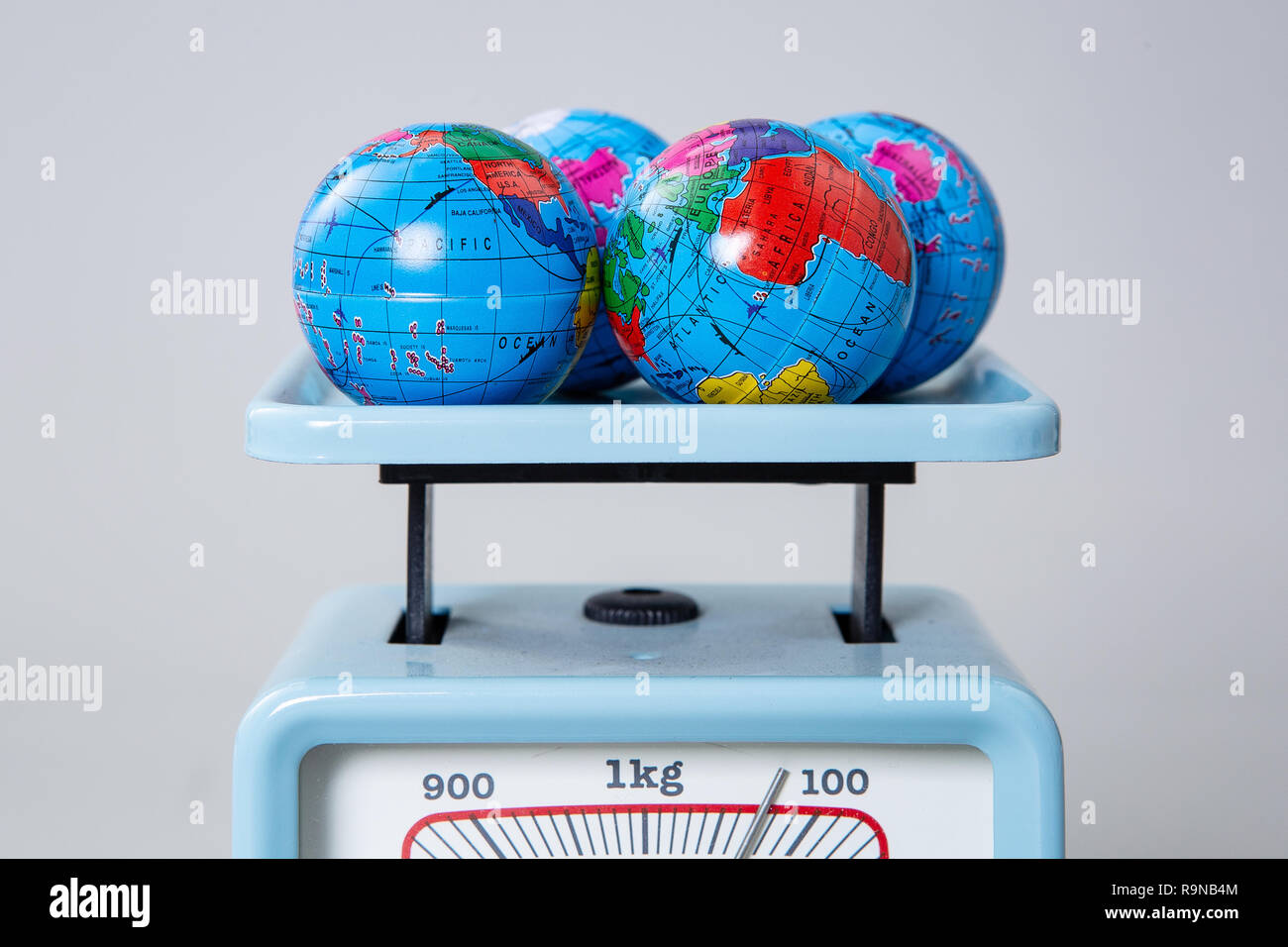 Scale and globe Stock Photo - Alamy