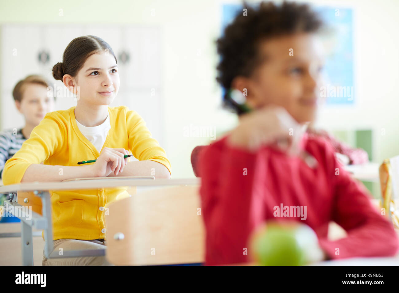 Curious school students at class Stock Photo - Alamy