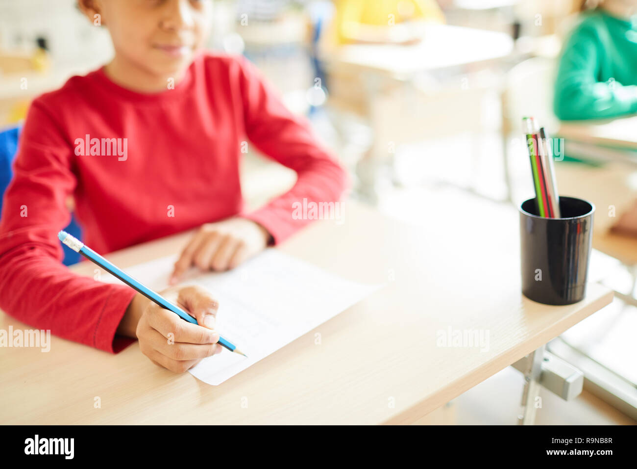 Taking test at class Stock Photo - Alamy