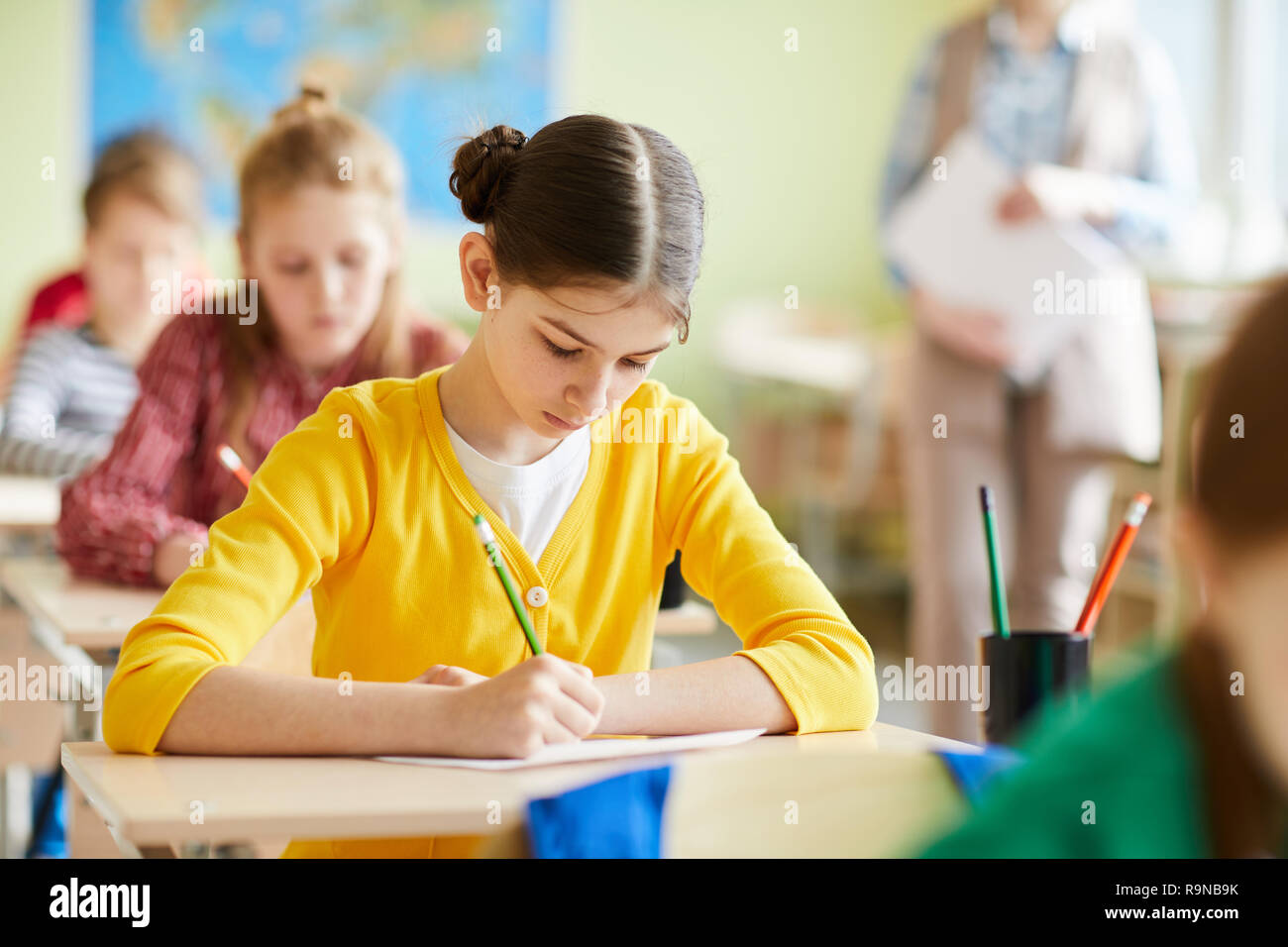 Busy student girl concentrated on quiz Stock Photo - Alamy