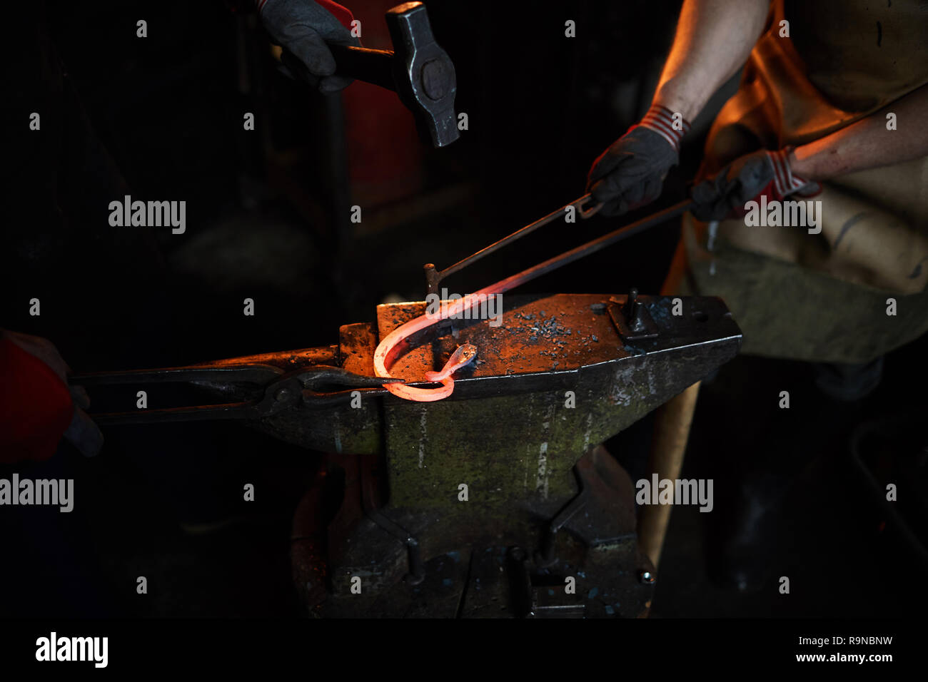 Producing metal part together Stock Photo - Alamy