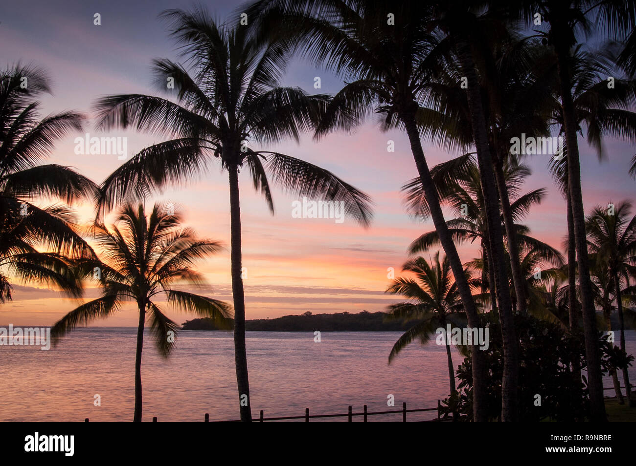 Tropical island sunset on the Coral Coast, Fiji Stock Photo - Alamy