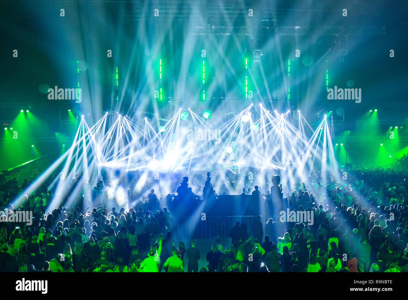 Scene illuminated by beautiful rays of lighting equipment. The concert ...