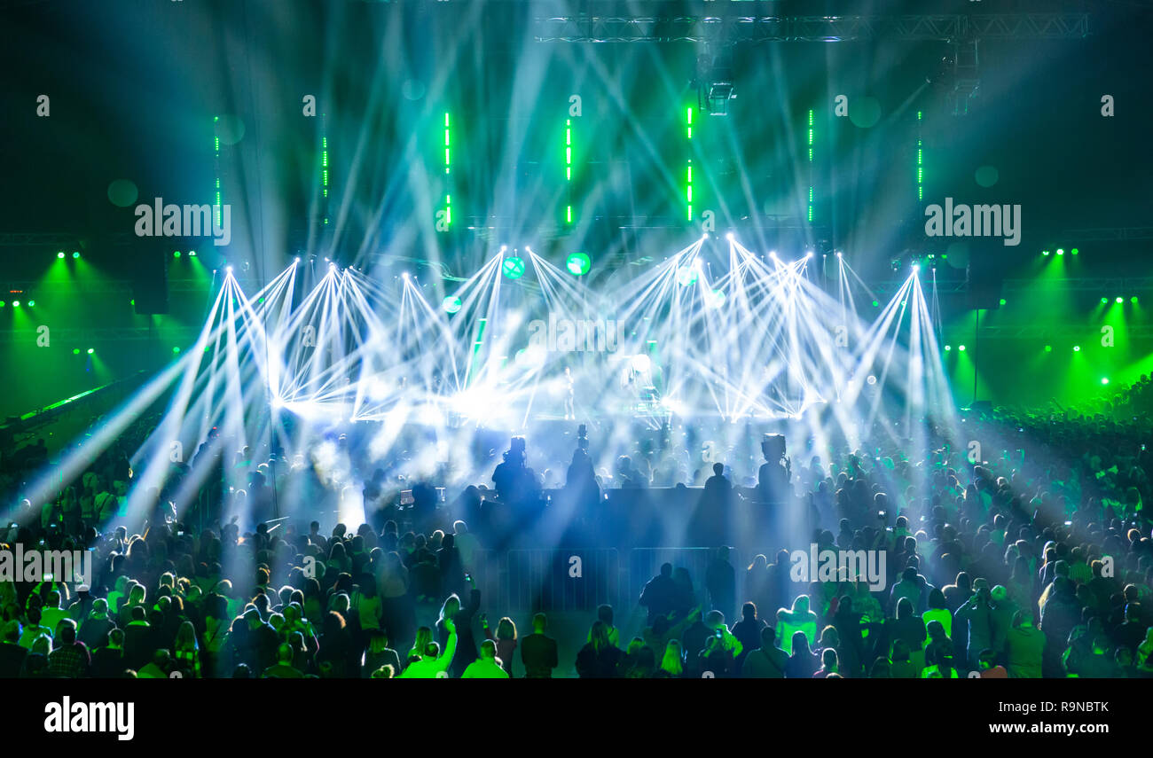 Scene illuminated by beautiful rays of lighting equipment. The concert ...