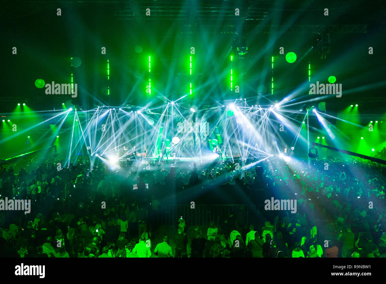 Scene illuminated by beautiful rays of lighting equipment. The concert ...