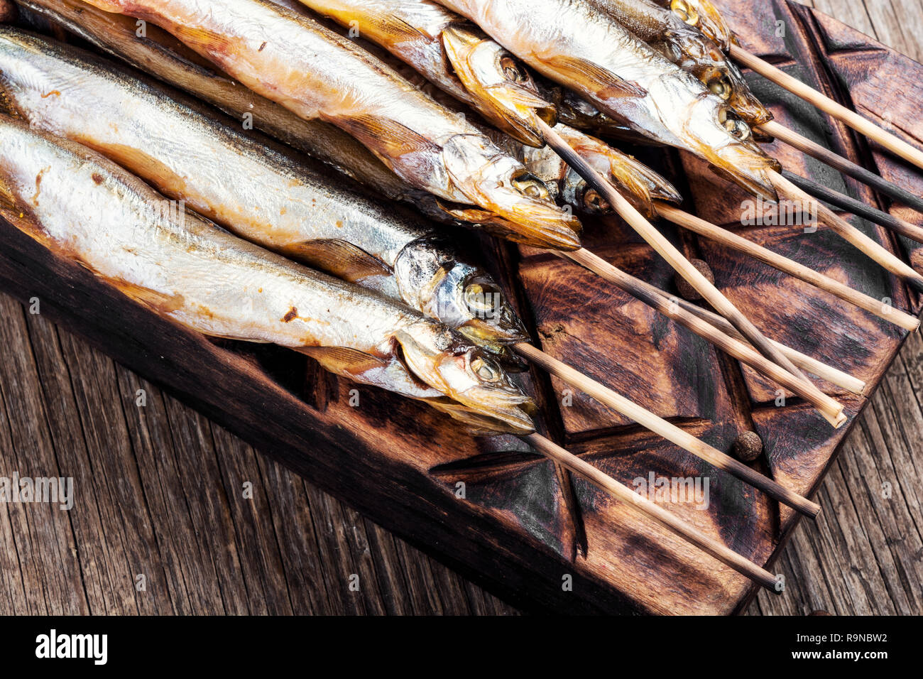 Smoked fish with spices.Cold smoked fish.Smoked capelin Stock Photo - Alamy