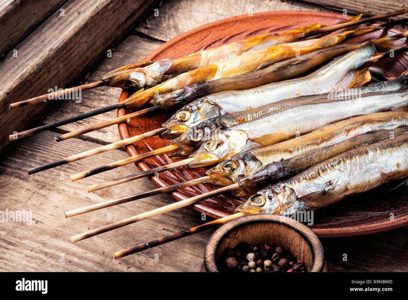 Smoked fish with spices.Smoked capelin.Traditional beer snack Stock ...