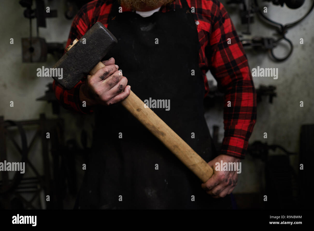 Young man with hammer hi-res stock photography and images - Alamy