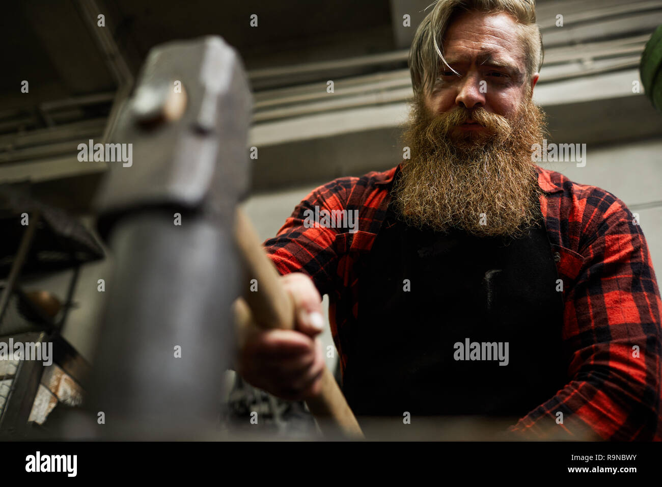 Metal hammering man hi-res stock photography and images - Alamy