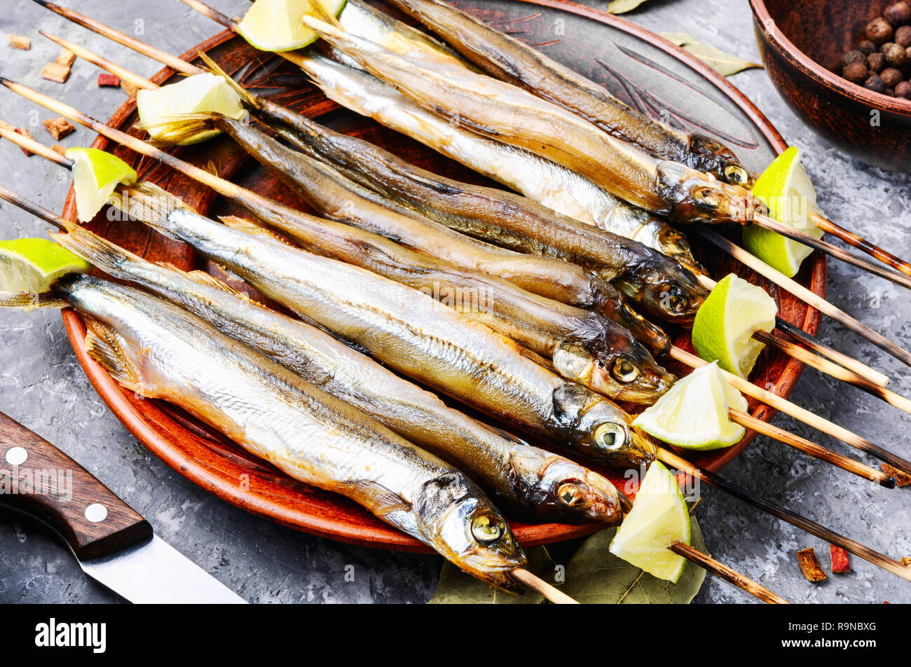 Smoked fish with spices.Cold smoked fish.Smoked capelin.Traditional ...
