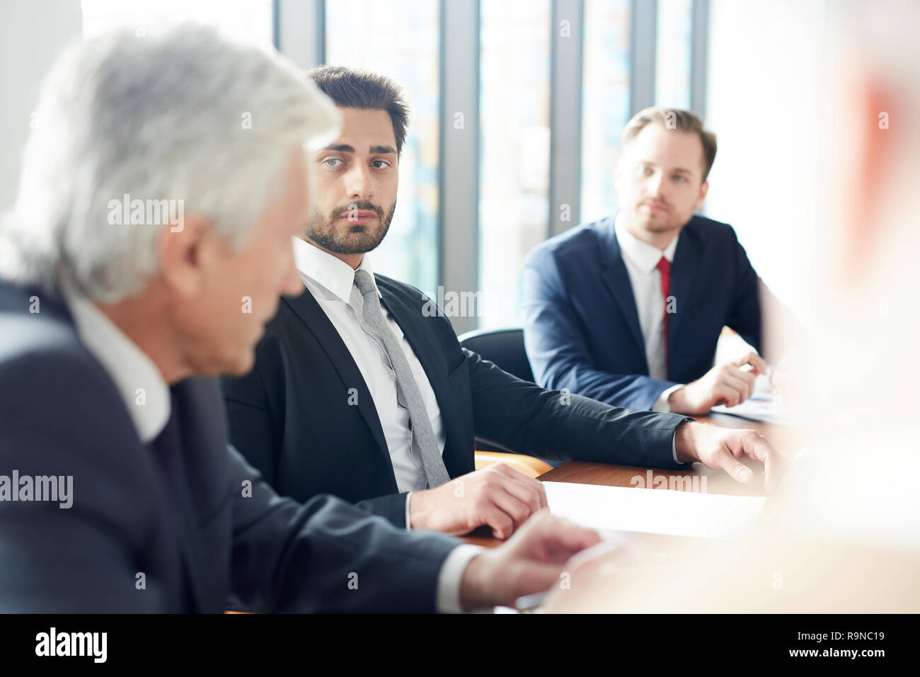 Listening to mature delegate Stock Photo - Alamy