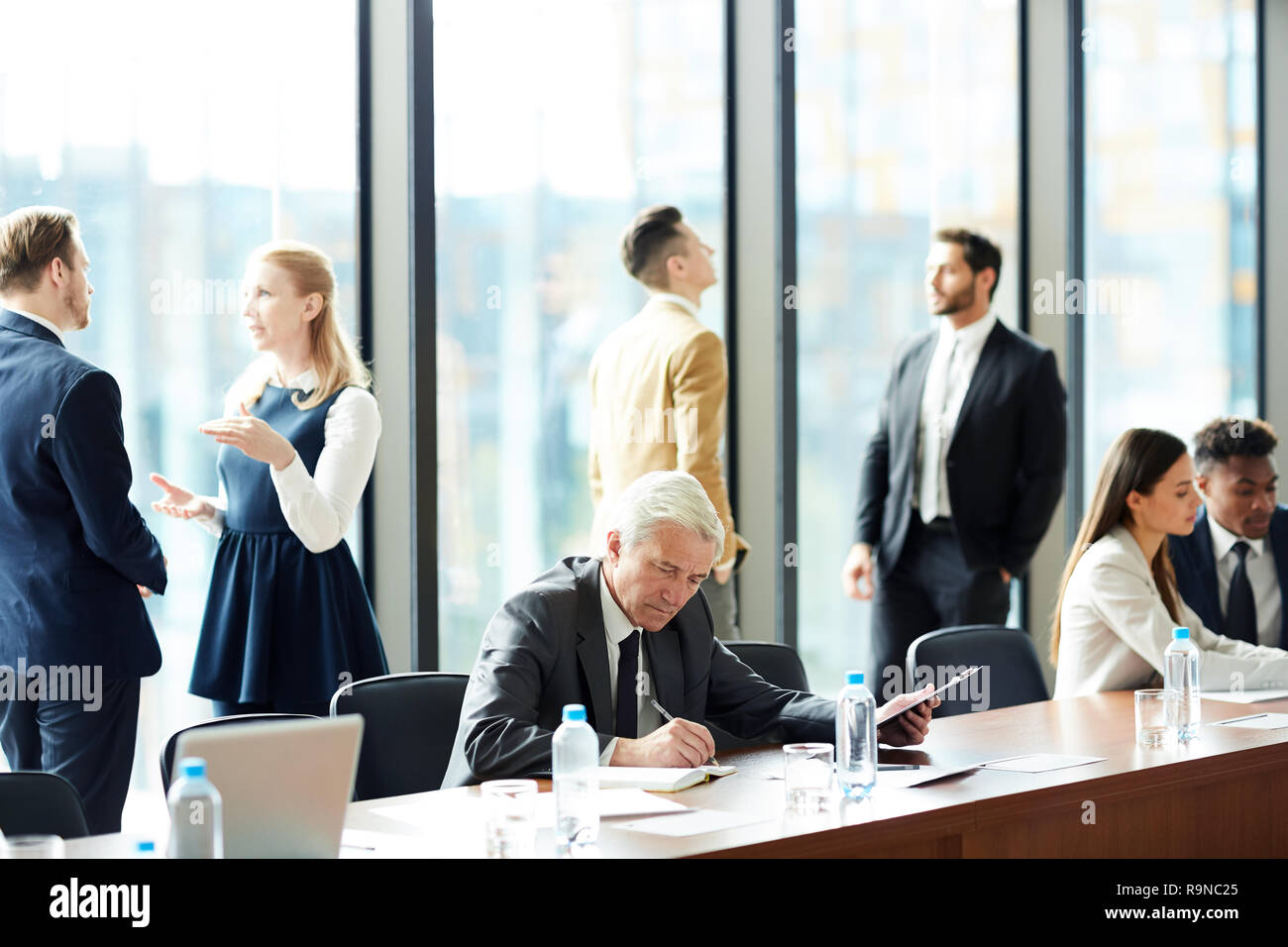 Working in conference-hall Stock Photo - Alamy