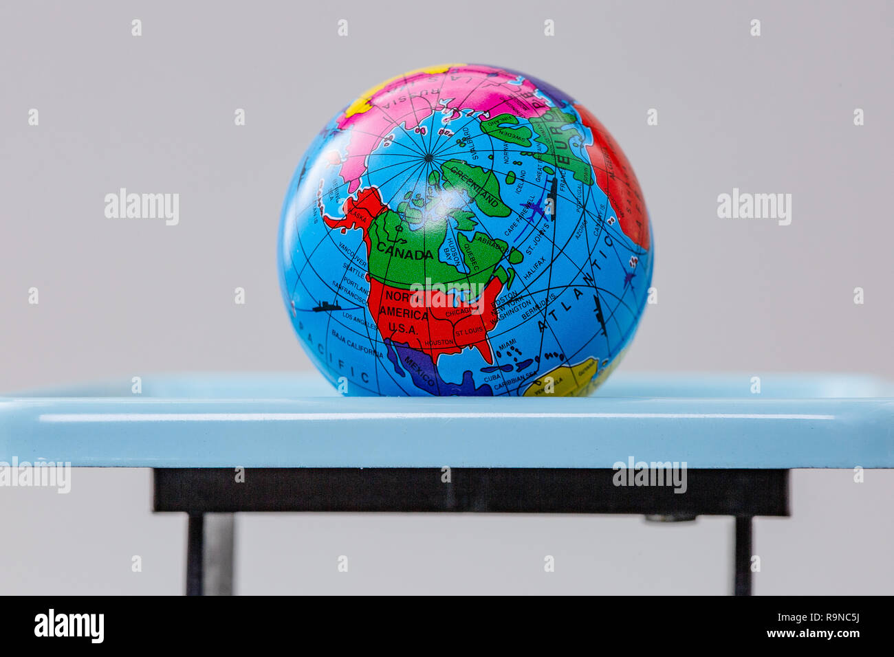 Scale and globe Stock Photo - Alamy