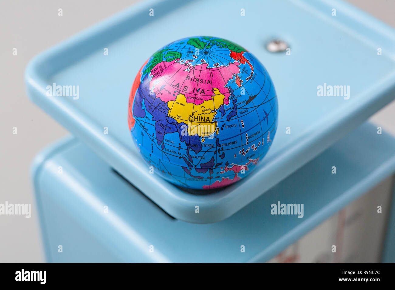Scale and globe Stock Photo - Alamy