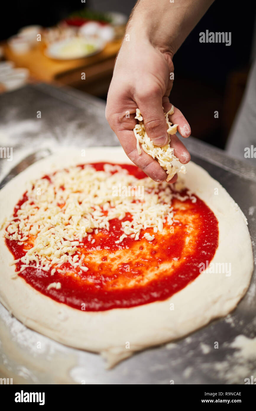 Sprinkling cheese hi-res stock photography and images - Alamy